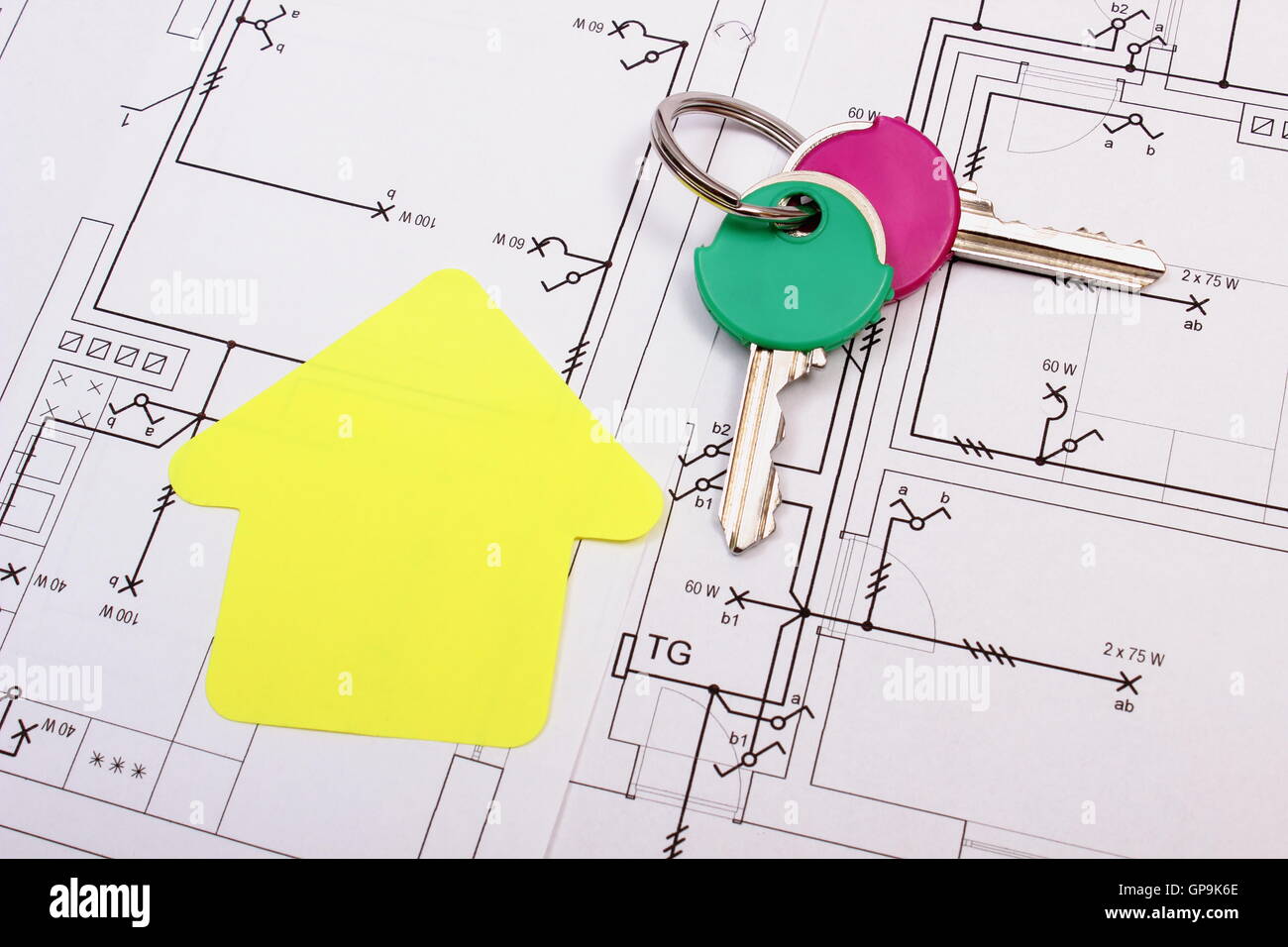 House of yellow paper and home keys lying on electrical construction ...