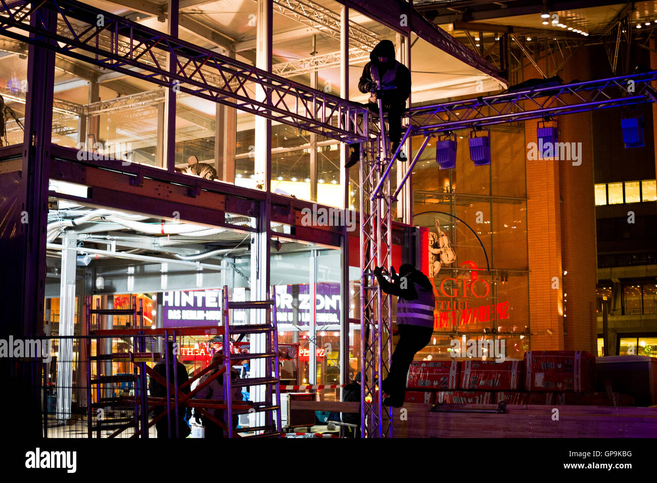 A man climbing lighting rigging on a pre-Berlinale construction site ...