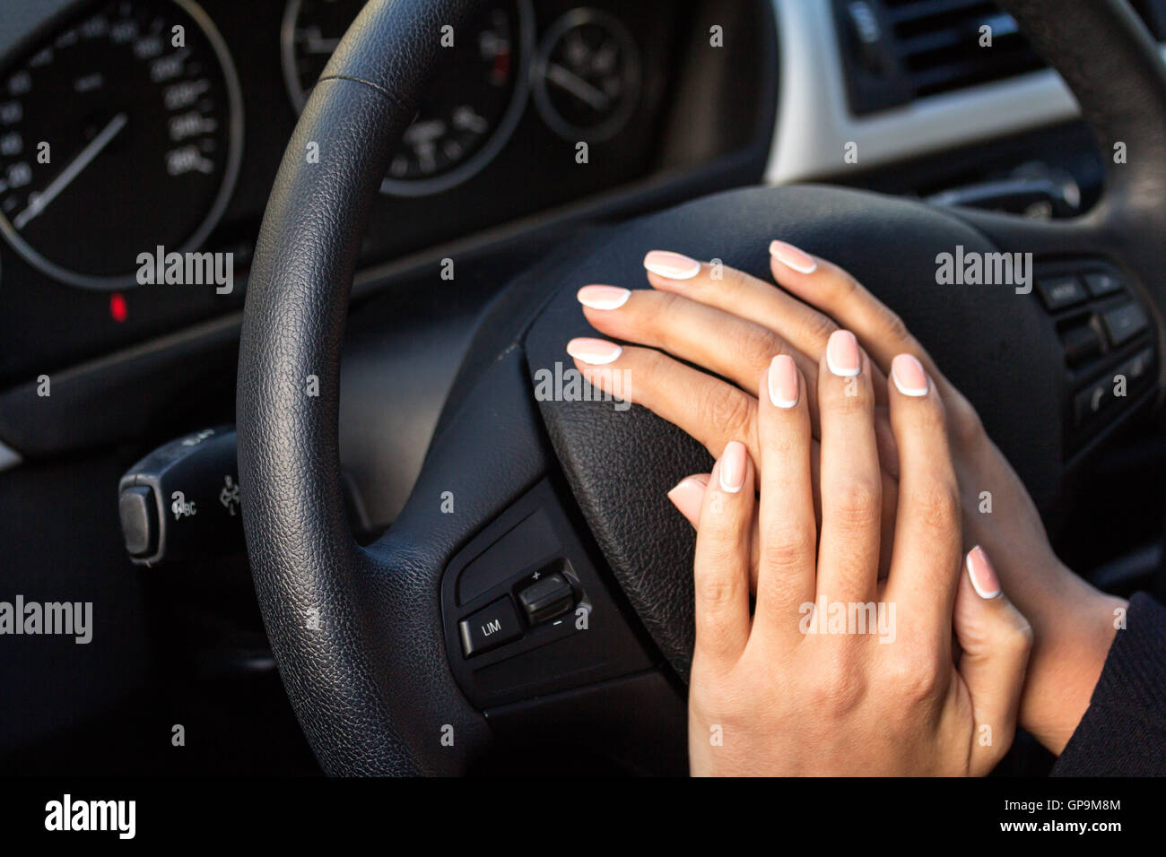 Woman hand steering wheel nails hi-res stock photography and images - Alamy