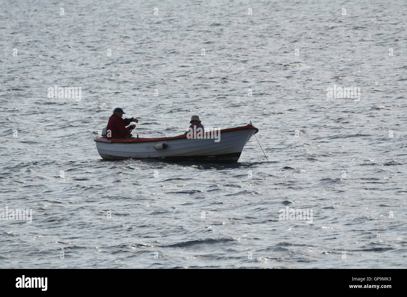 Old man rowing boat hi-res stock photography and images - Alamy