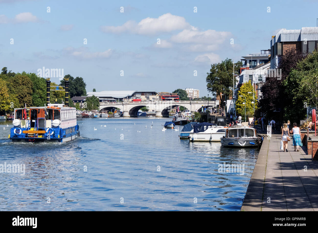 Thames riverside in Kingston upon Thames with Kingston Bridge in the ...