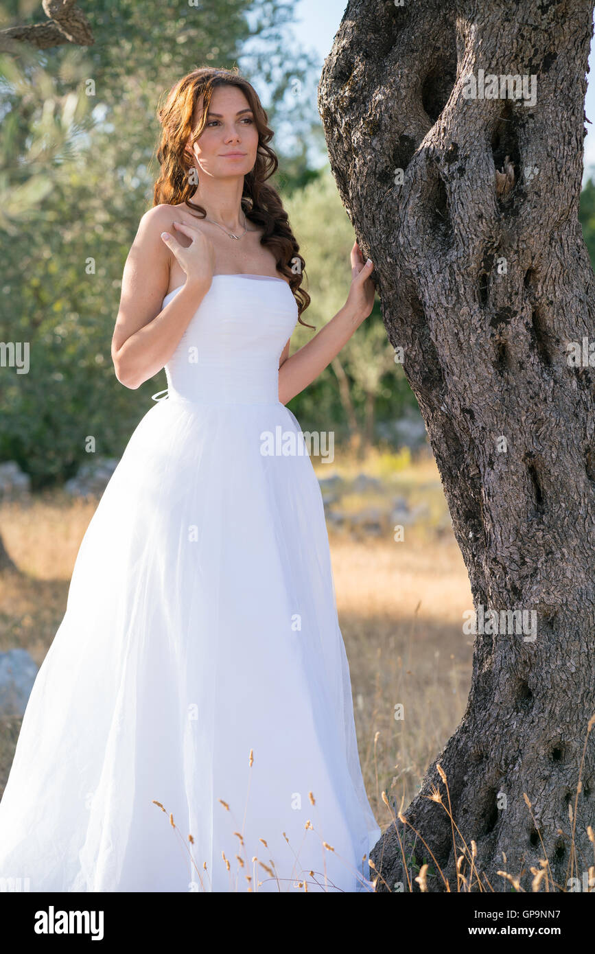 Attractive Young Woman Enjoying Her Time Outside In Olive Trees Stock