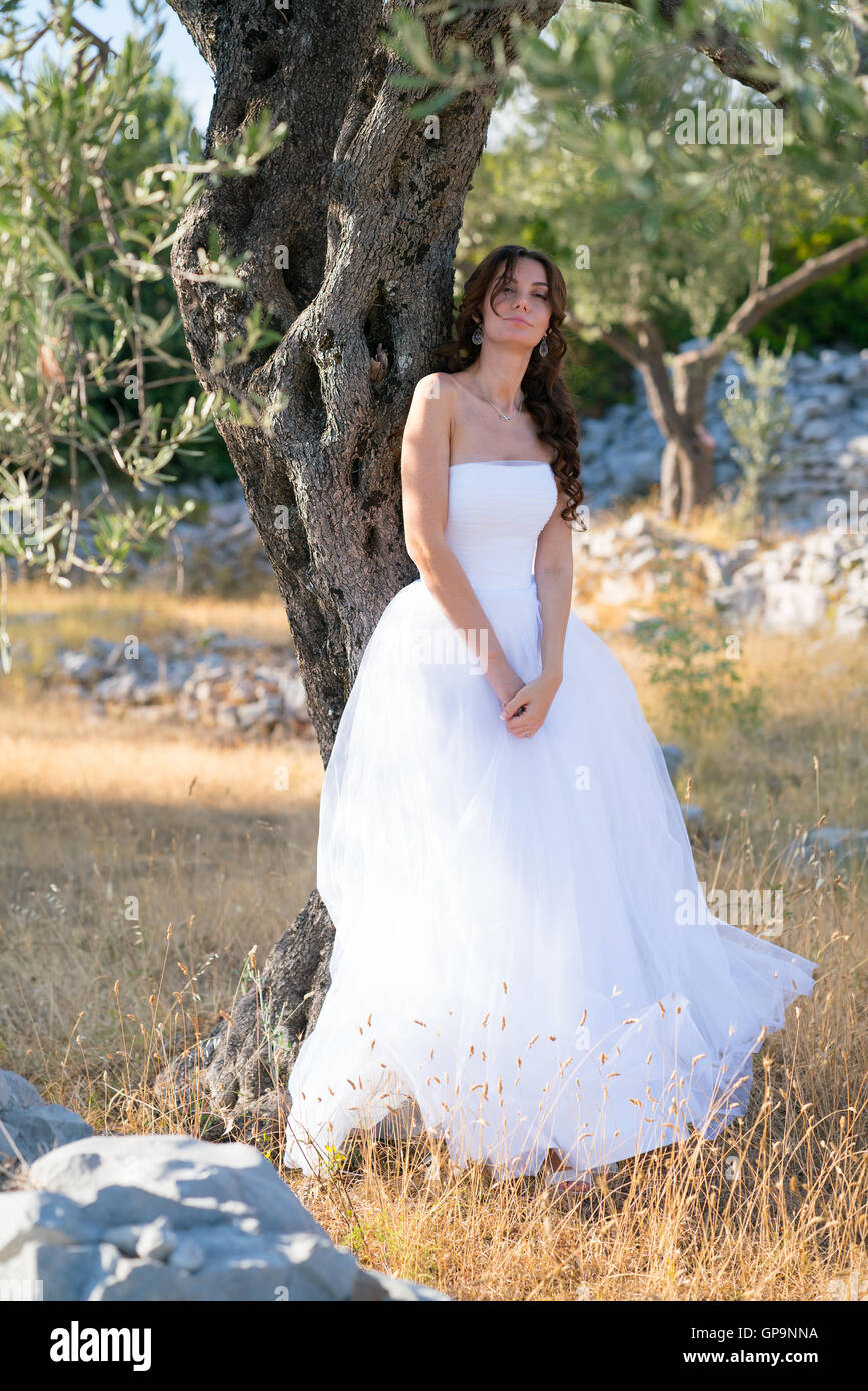 Attractive Young Woman Enjoying Her Time Outside In Olive Trees Stock