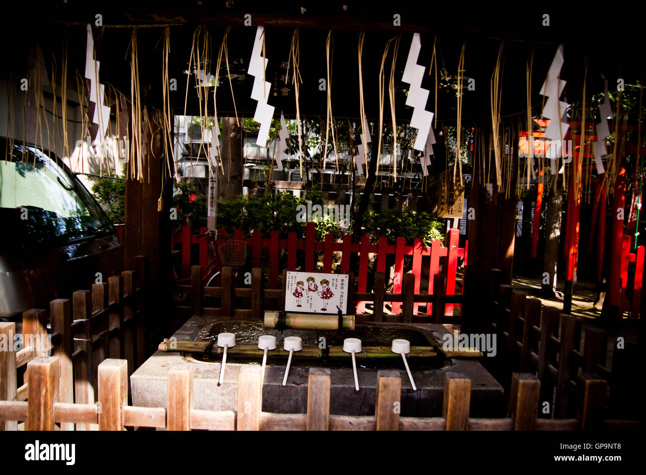 Water cups lined up at a trough in a temple in Tokyo, Japan Stock Photo ...
