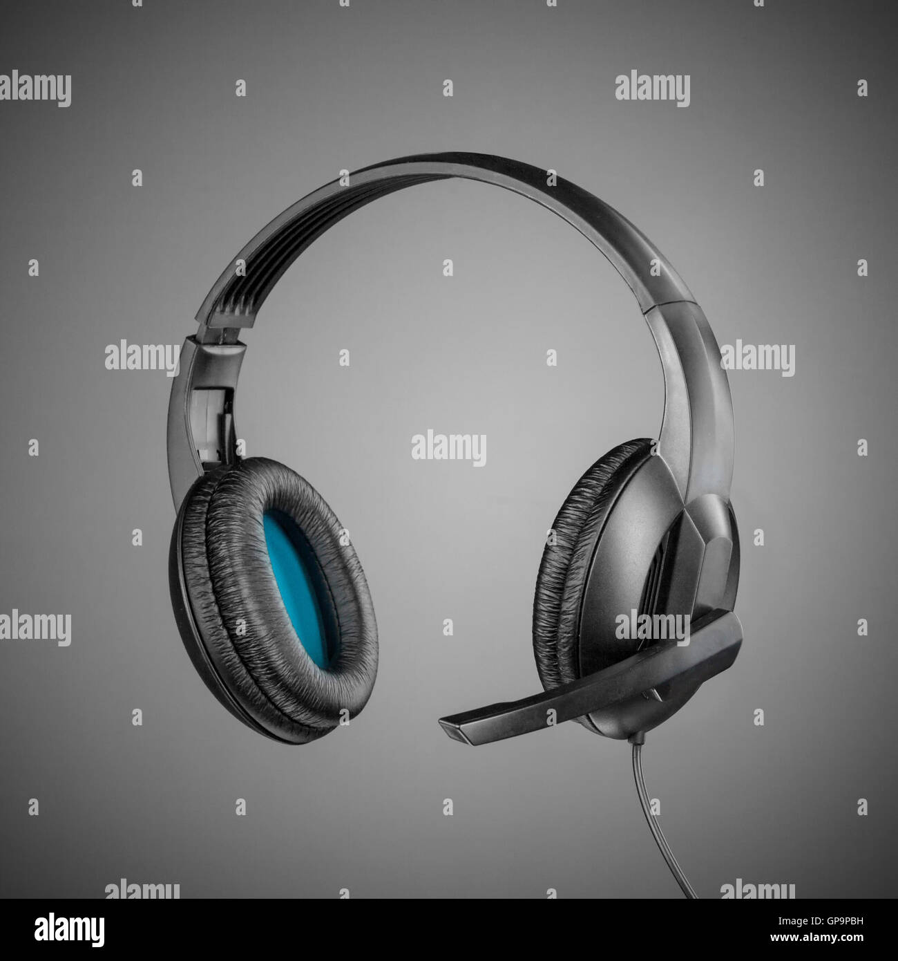 Headphones on grey background Stock Photo - Alamy
