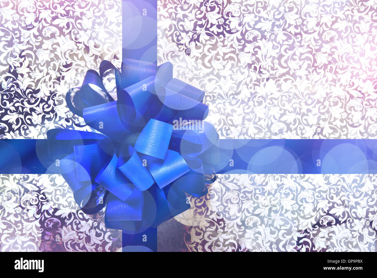 Gift with blue bow and ribbon Stock Photo - Alamy