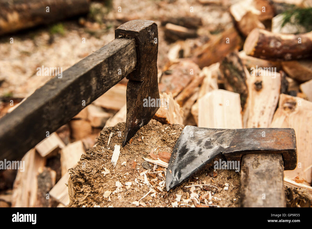 Two axes on a chopping block Stock Photo - Alamy
