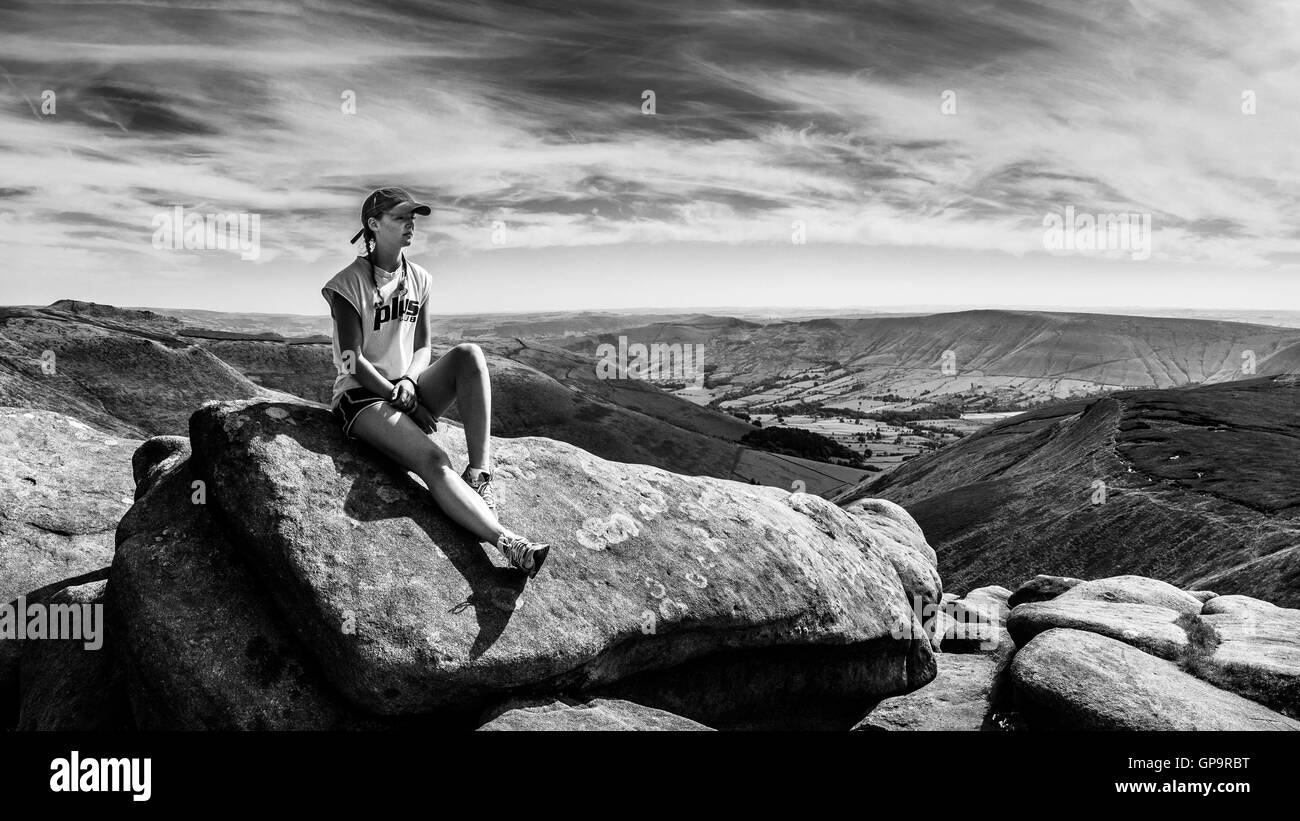Young woman on cliff top - B&W Stock Photo - Alamy