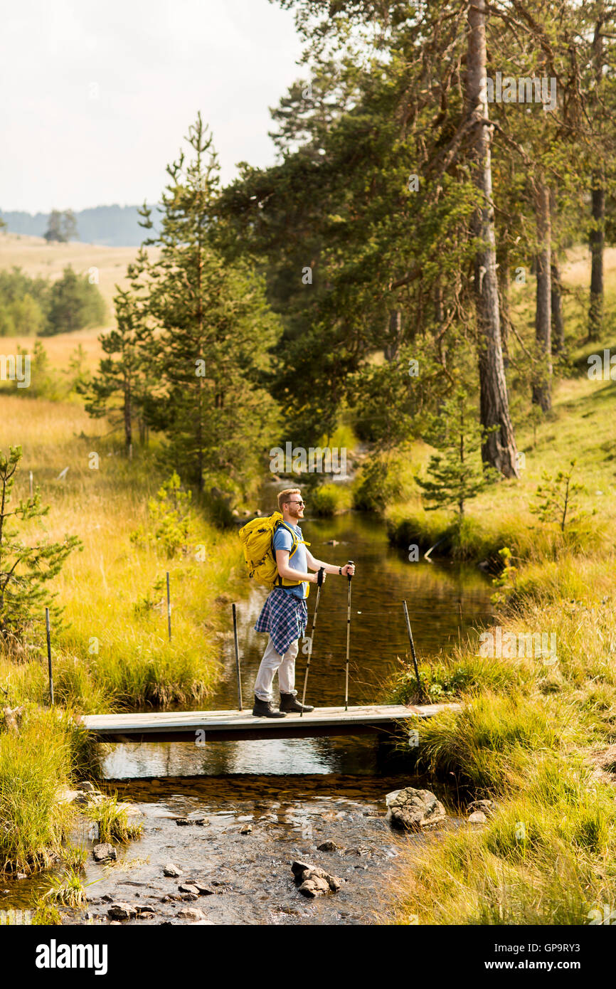 Young man crosses mountain hi-res stock photography and images - Alamy
