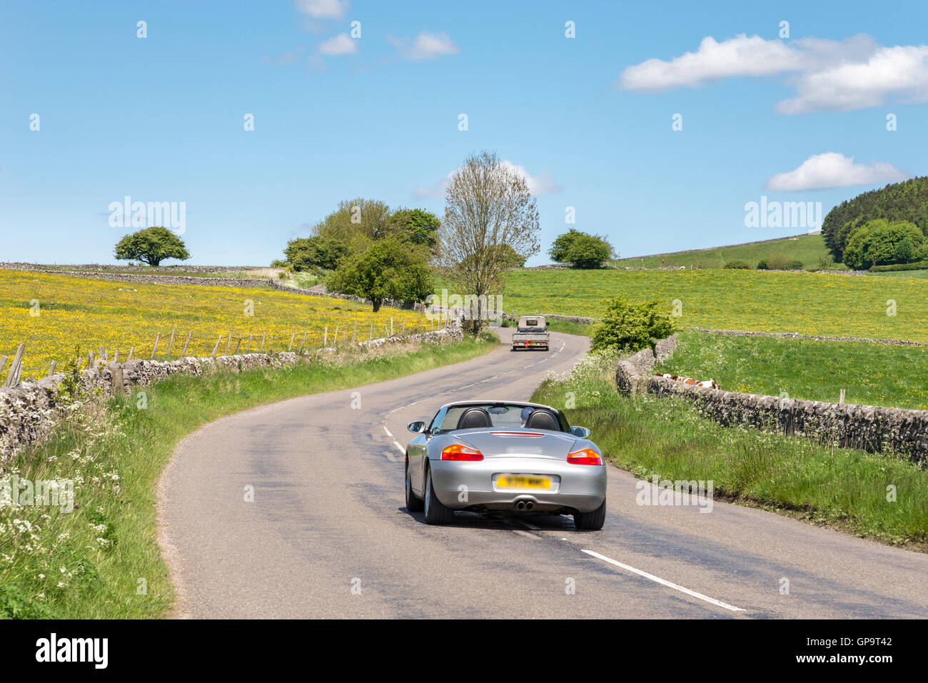 Sports car driving down rural road hi-res stock photography and images ...