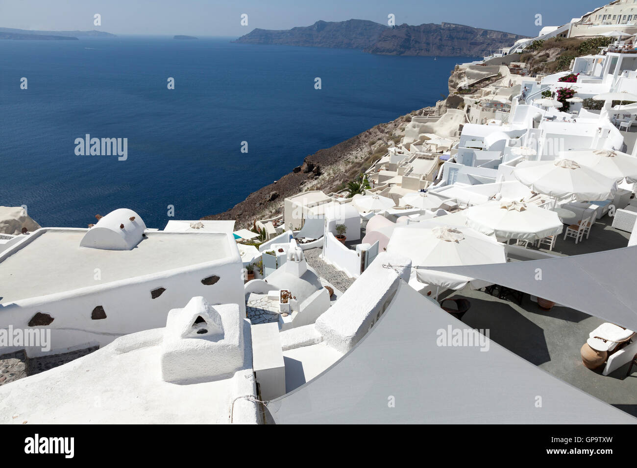 Traditional white buildings on the vibrant, hot and sunny Greek Island ...