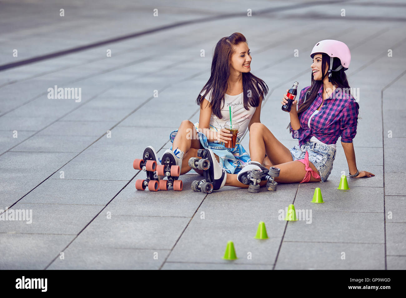 Two girls skating hi-res stock photography and images - Alamy