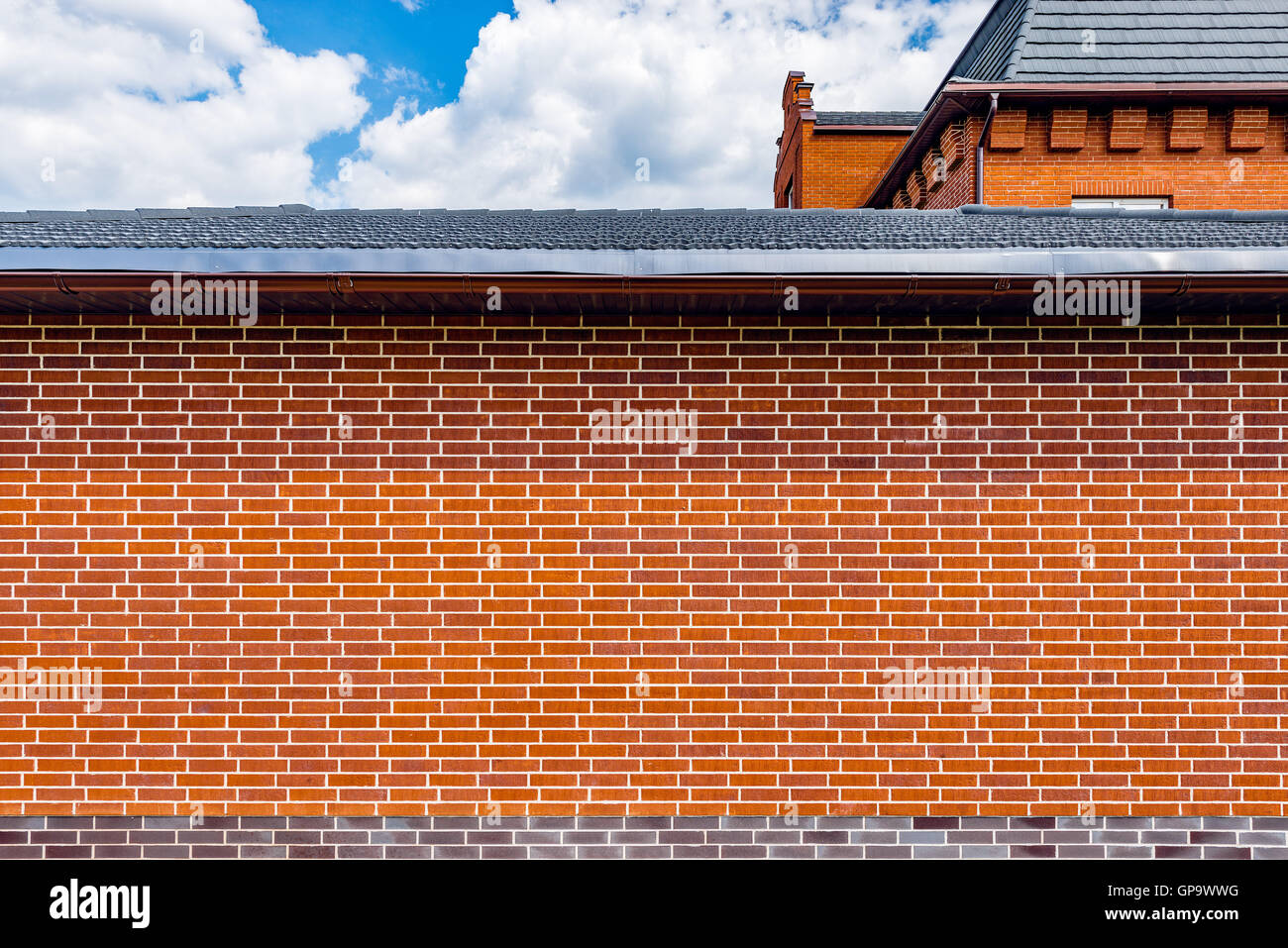 Red brick fence around the big luxury house Stock Photo - Alamy