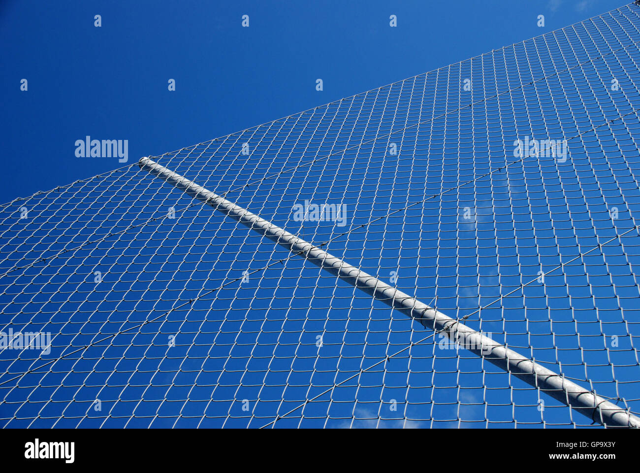 A barrier of fence netting against the sky Stock Photo - Alamy