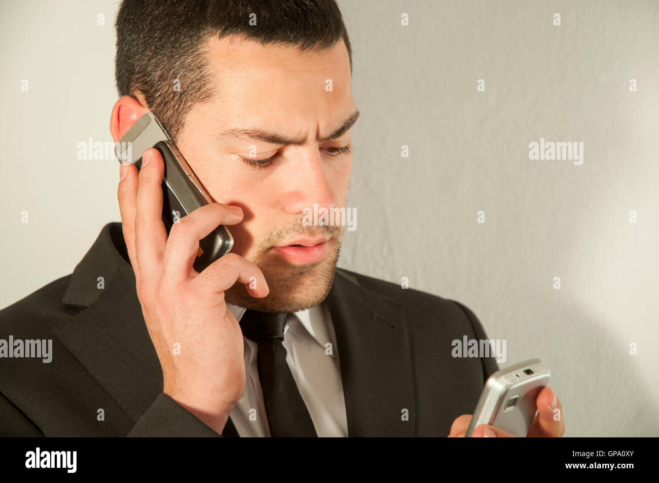 People staring at their mobile phones hi-res stock photography and ...
