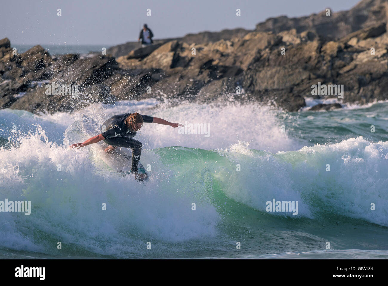 A surfer in spectacular action at Fistral in Newquay, Cornwall. UK ...