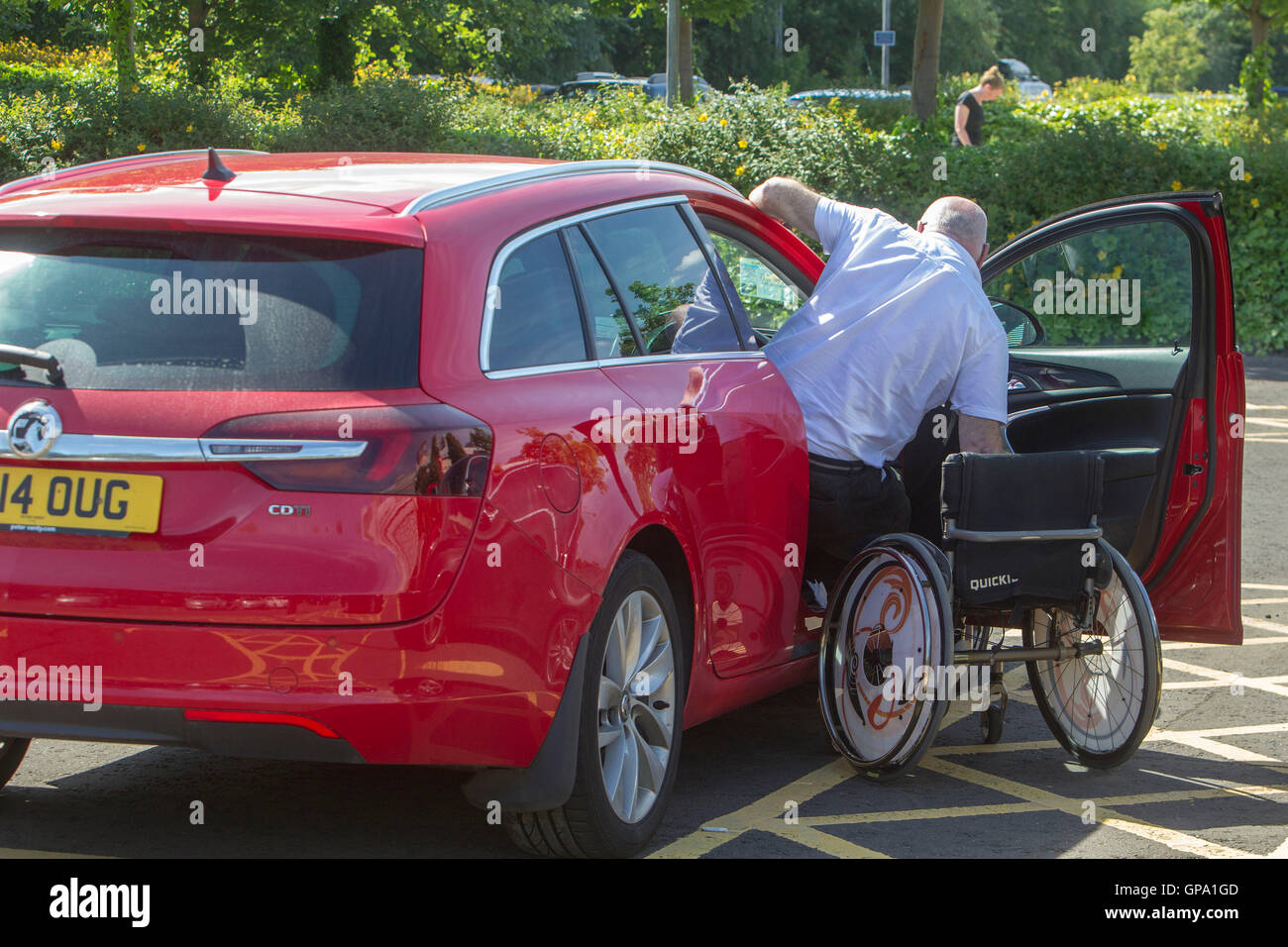 Disabled person using public transport Stock Photo - Alamy