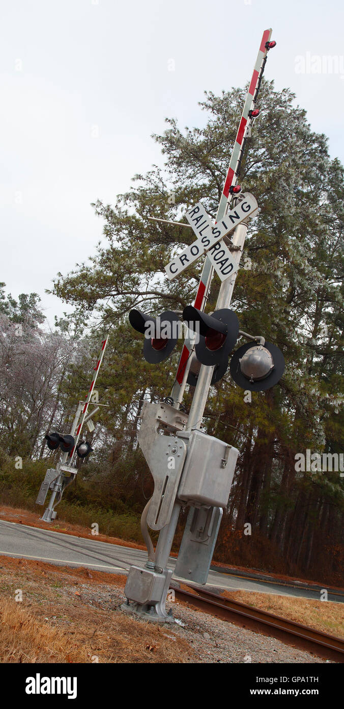 Pair of railroad crossing signs on a small road Stock Photo - Alamy