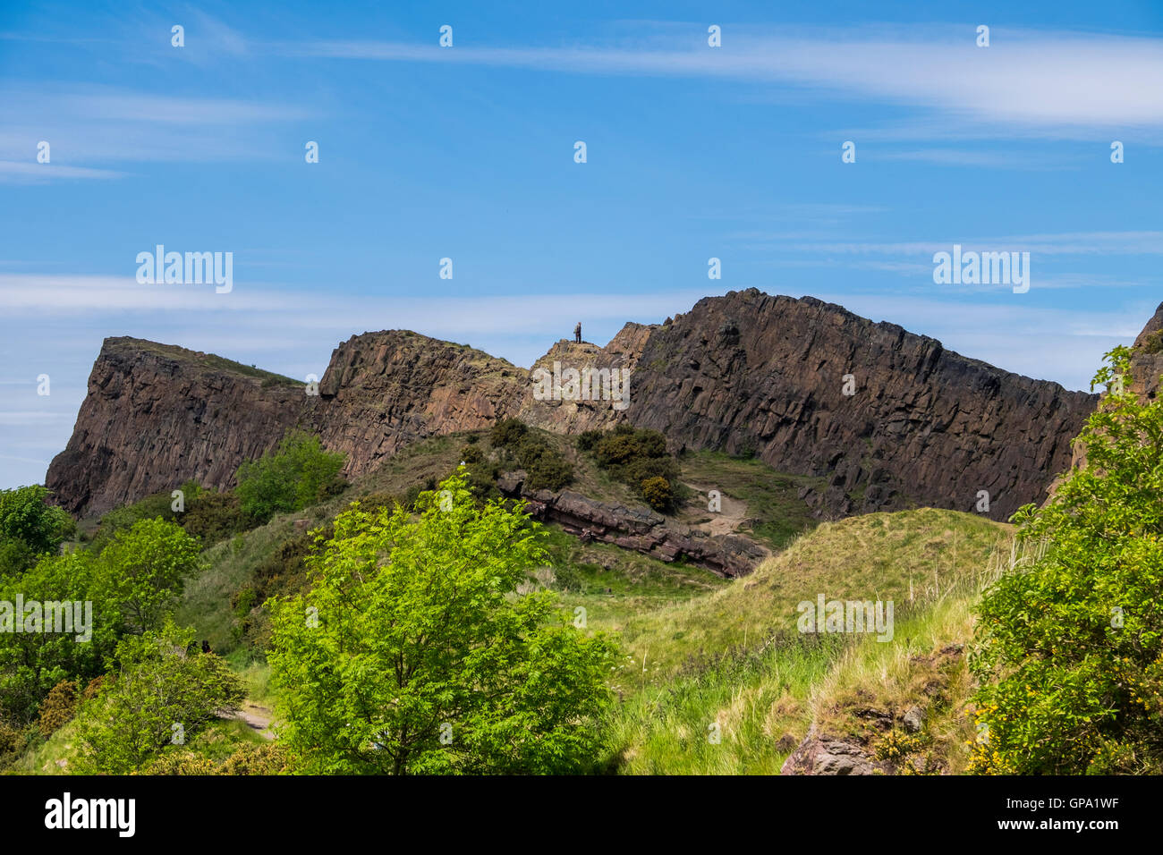 Rugged ancient volcanic rock formations of Salisbury Crags in Edinburgh ...