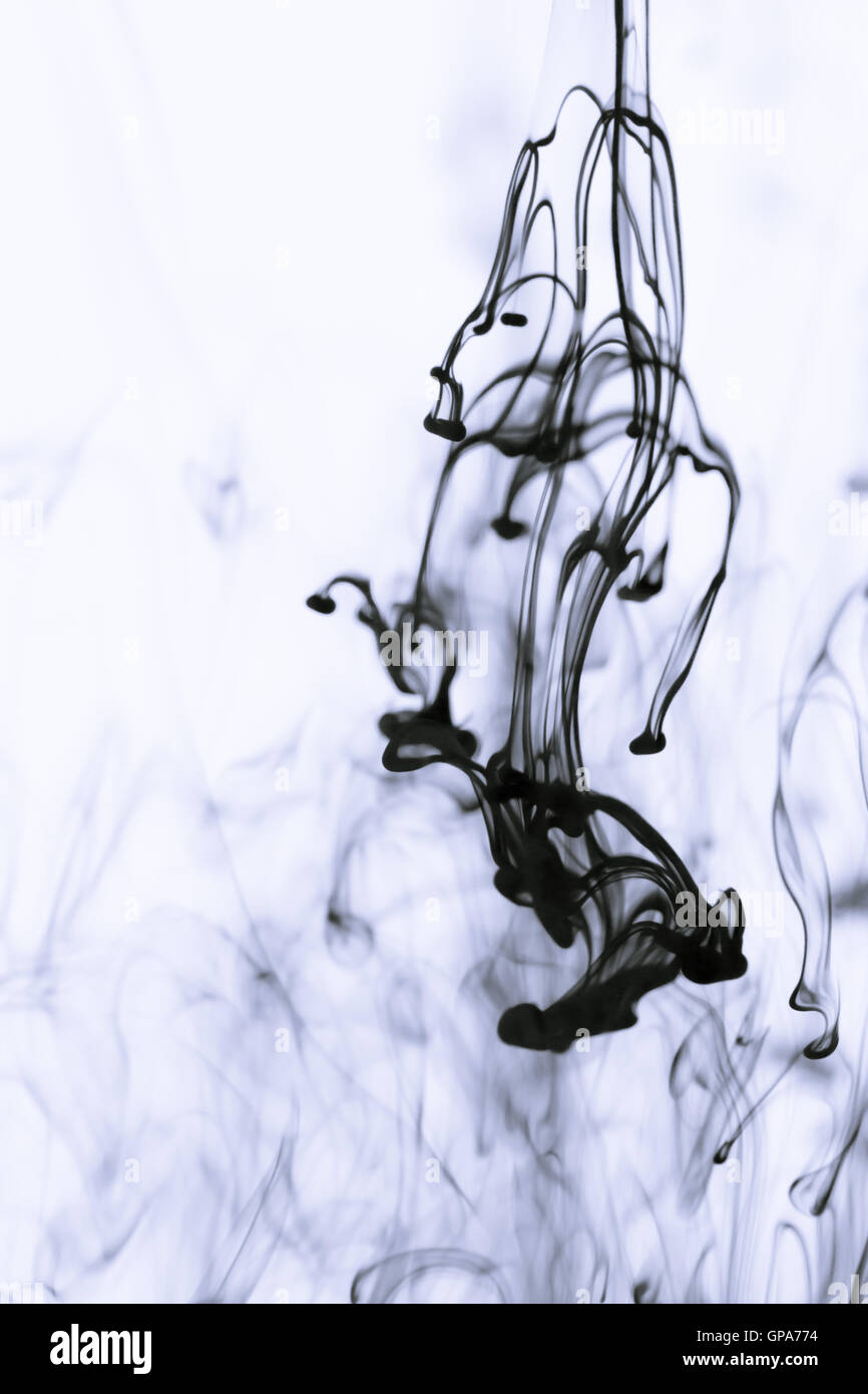 Black ink flowing through water Stock Photo - Alamy