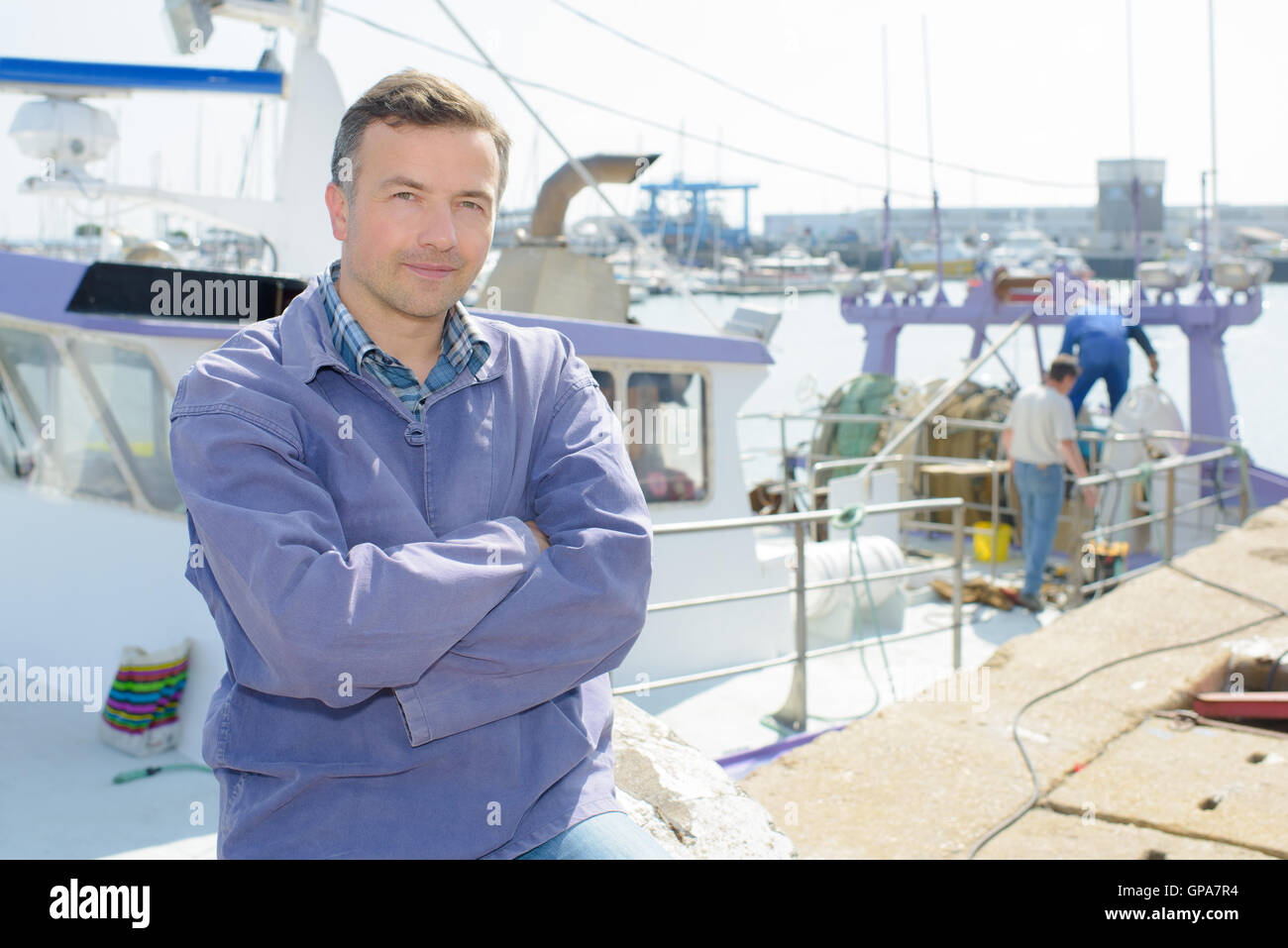 man posing at the harbor Stock Photo - Alamy