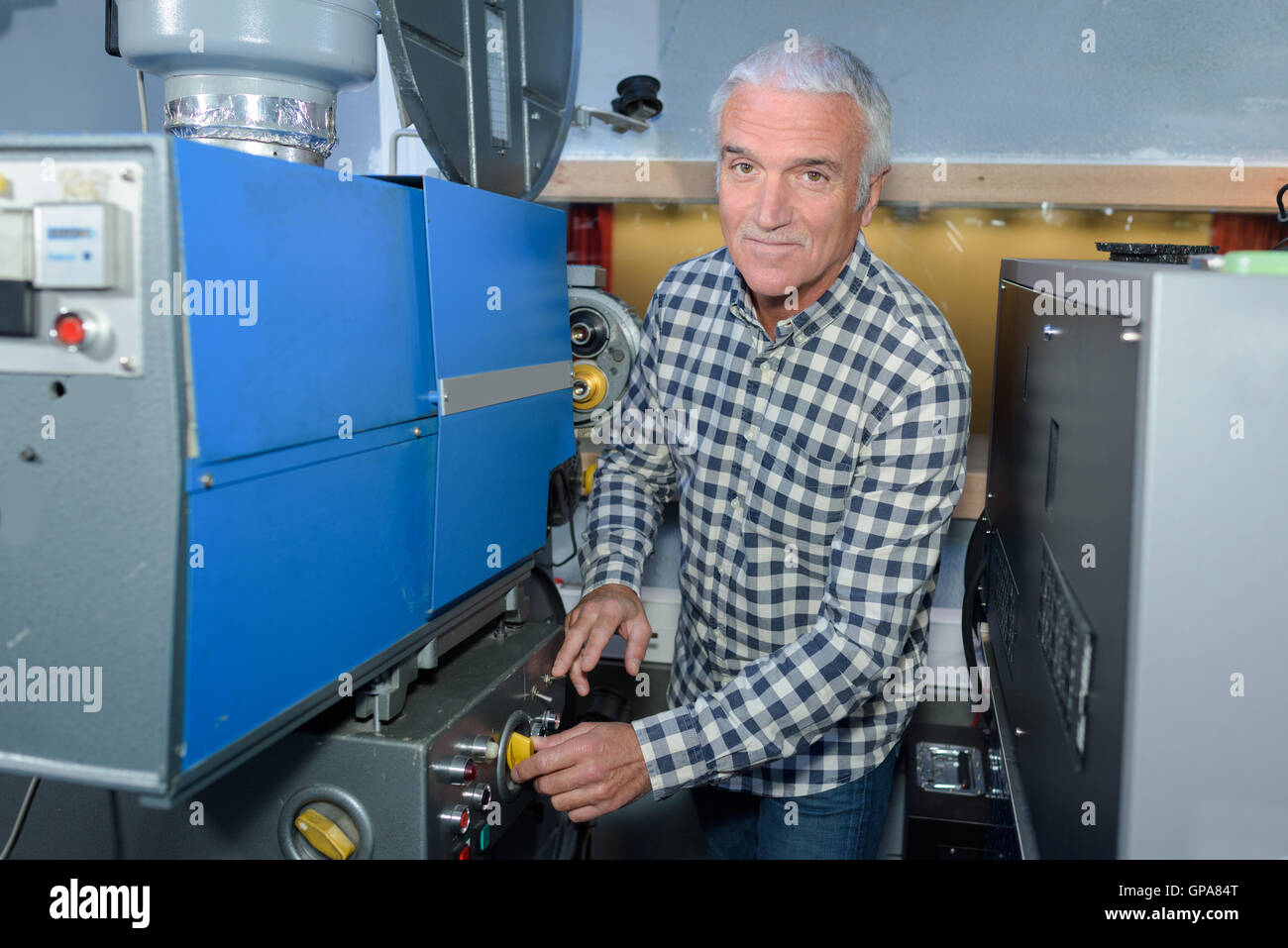 man operating machine Stock Photo - Alamy
