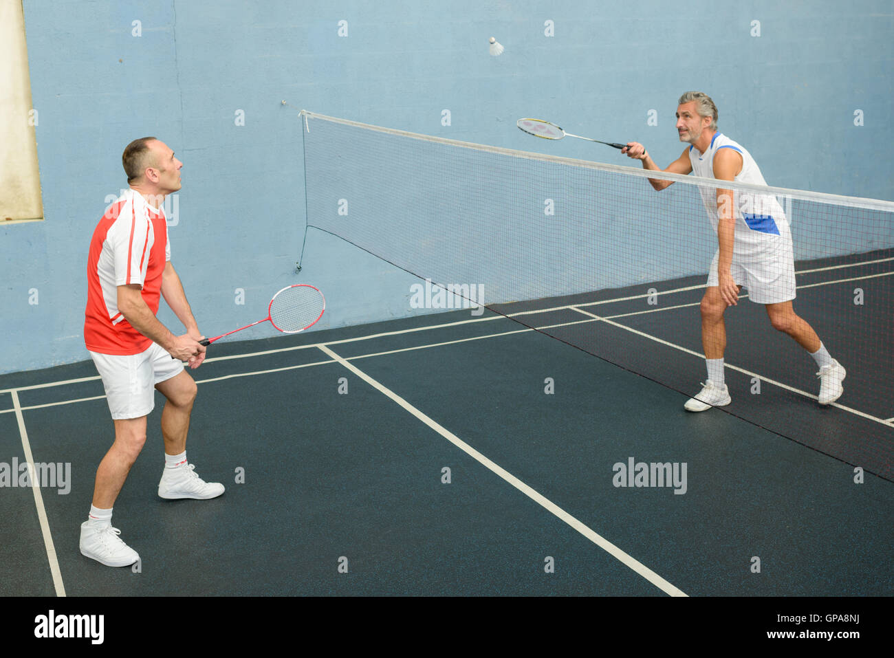 Men playing badminton Stock Photo - Alamy