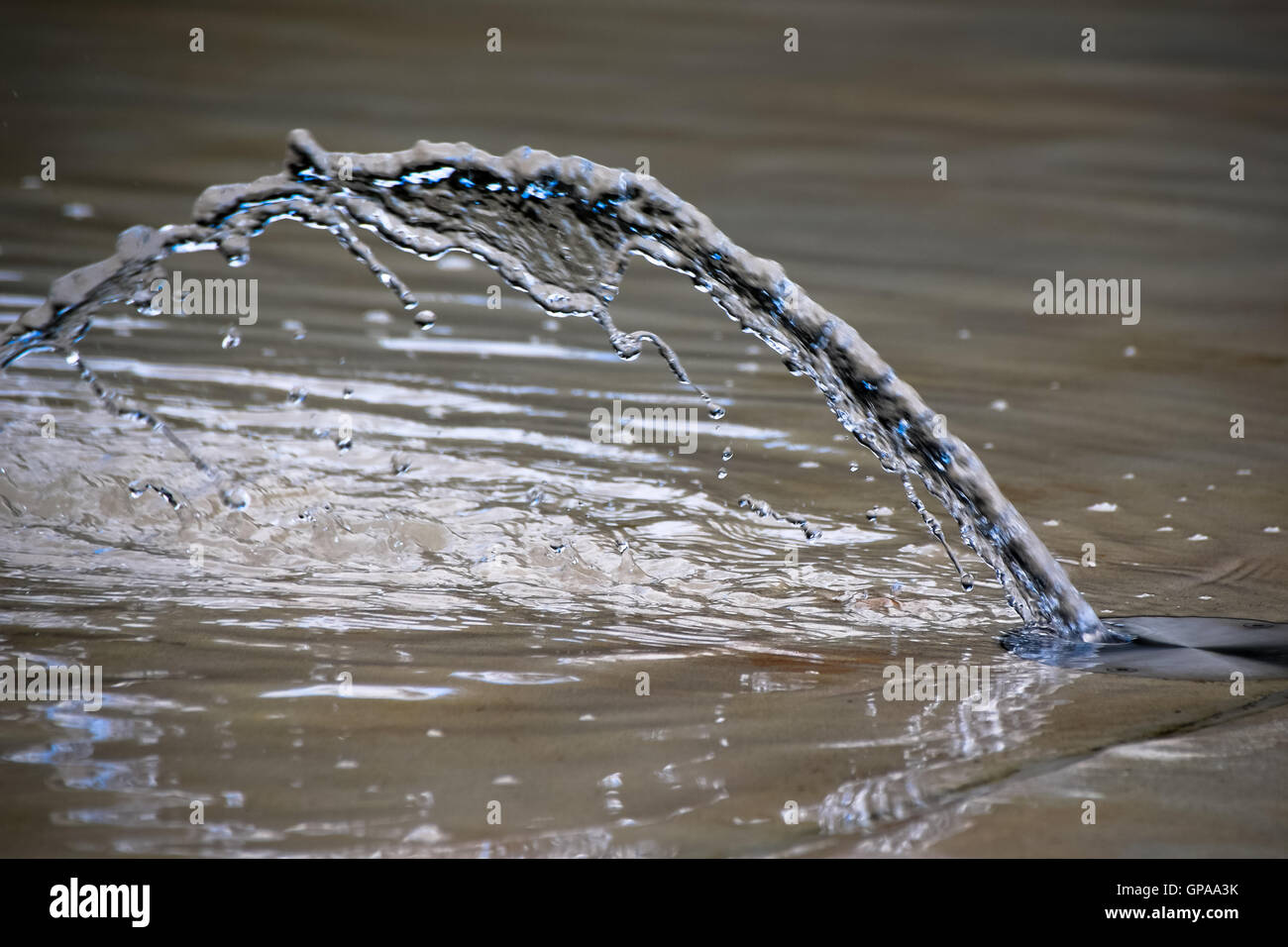 Curve of a jet of water from a fountain Stock Photo - Alamy