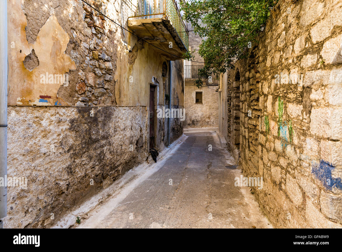Old narrow street in the village of Pirgi in Chios Island, Greece Stock ...