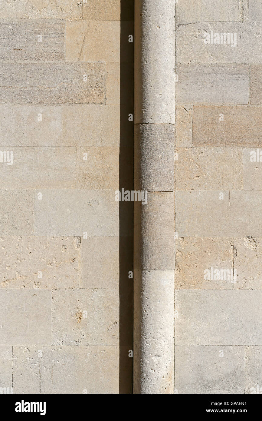 Old stone wall closeup architectural detail background with shadow on ...