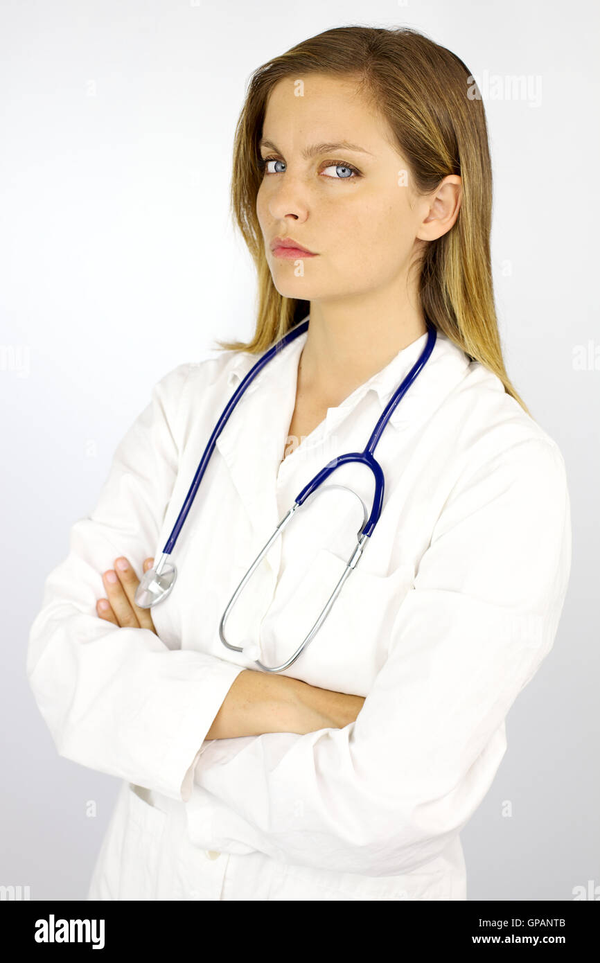 Serious good looking female doctor looking Stock Photo - Alamy