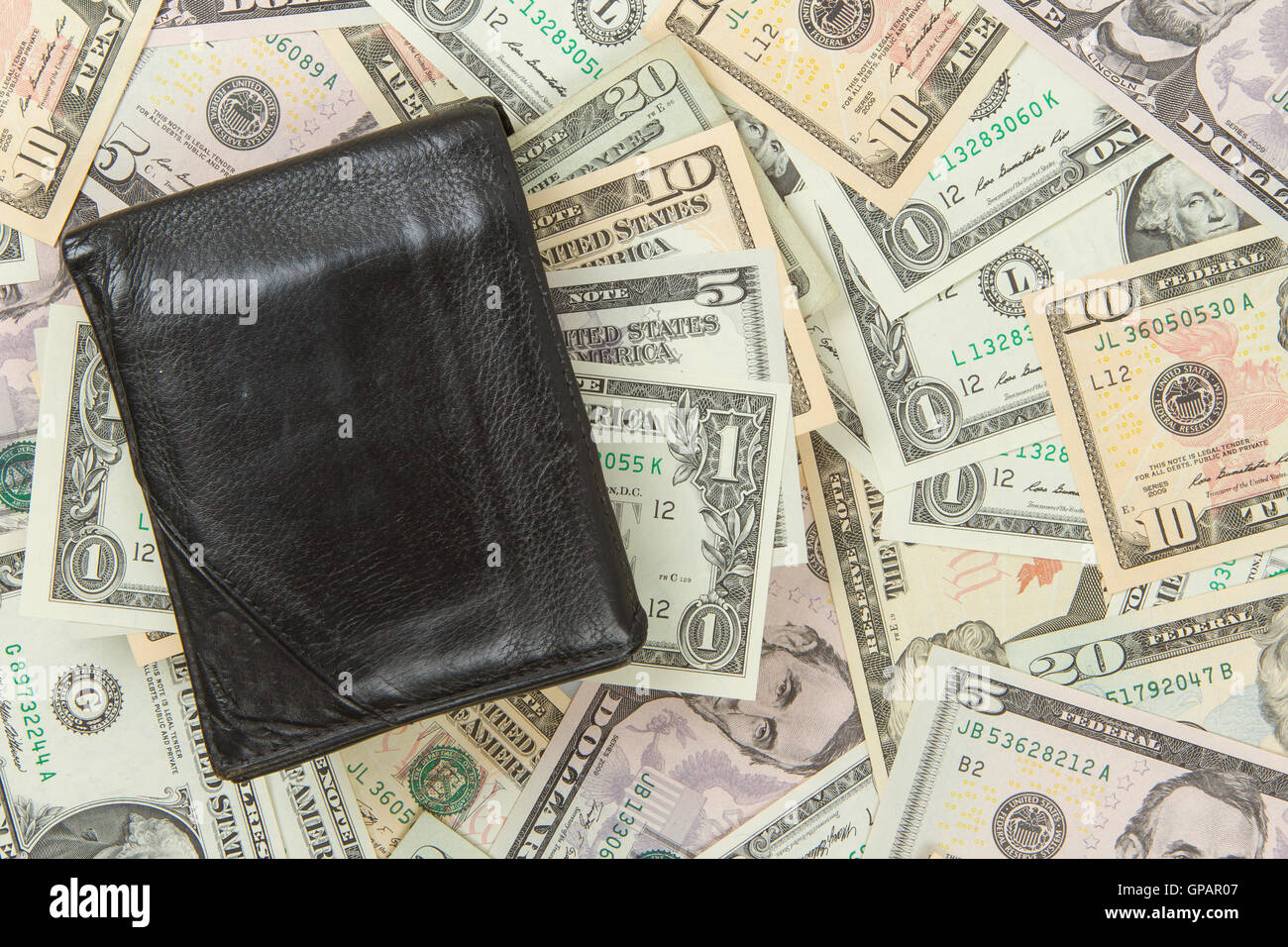 Old used wallet with dollars Stock Photo - Alamy