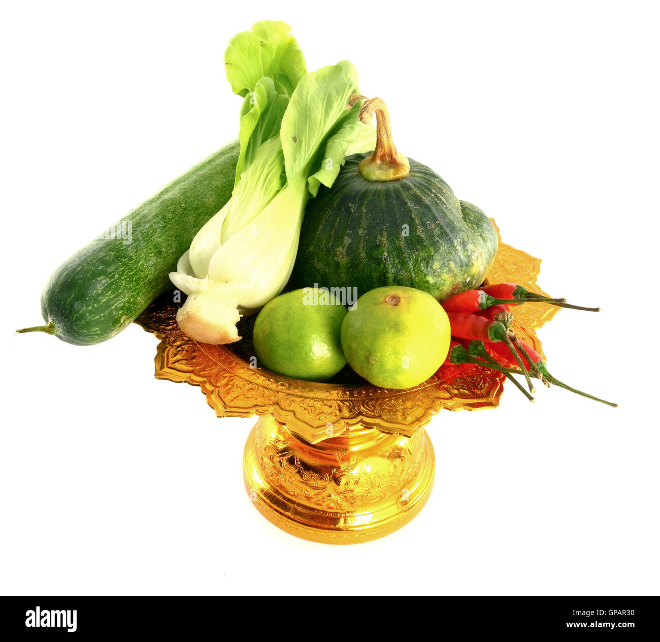 Vegetables mix on golden tray on white background Stock Photo - Alamy