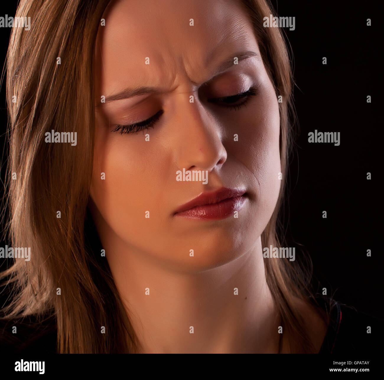 Young girl unsure about something Stock Photo - Alamy