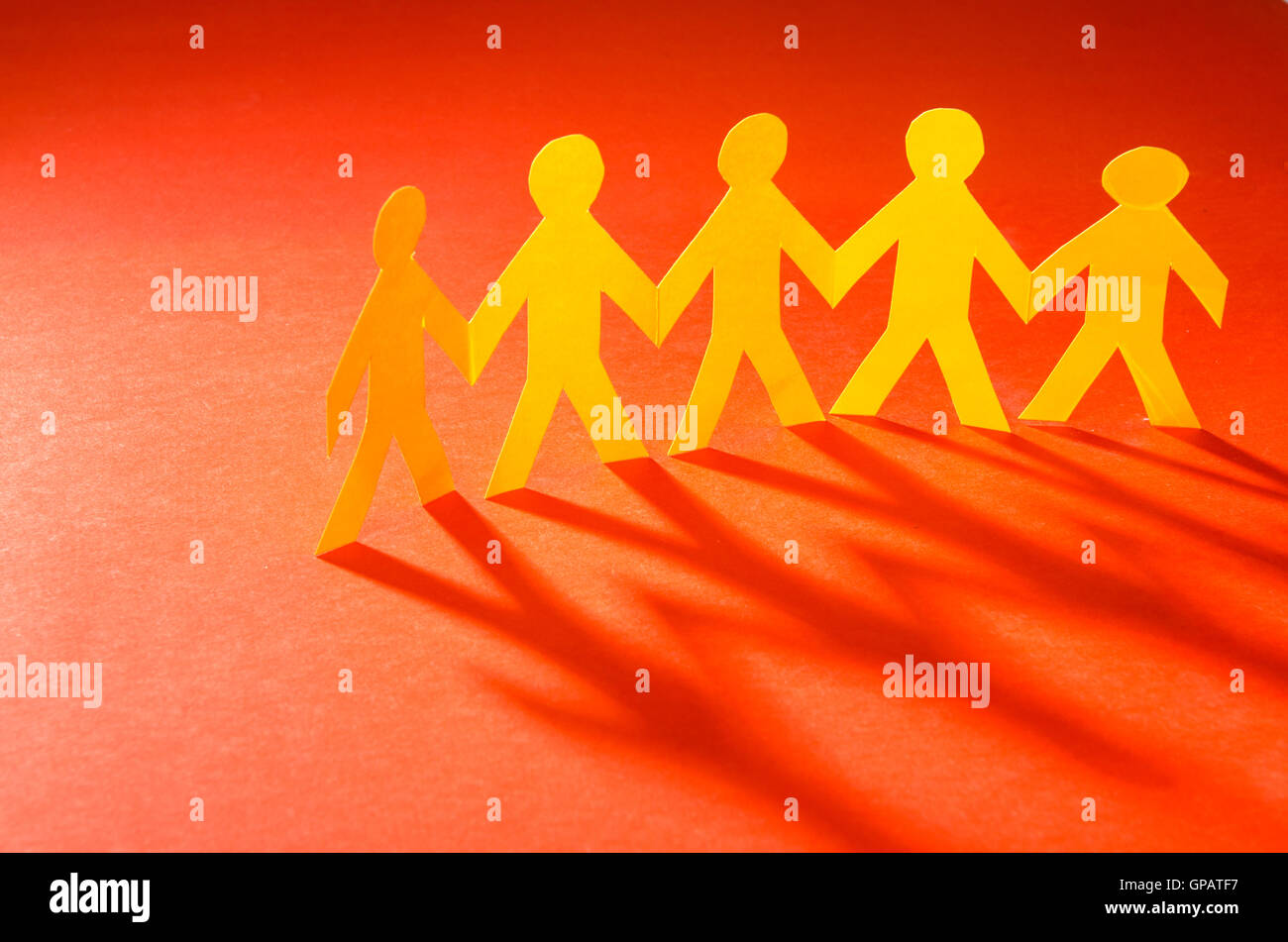 Paper people in teamworking concept Stock Photo - Alamy