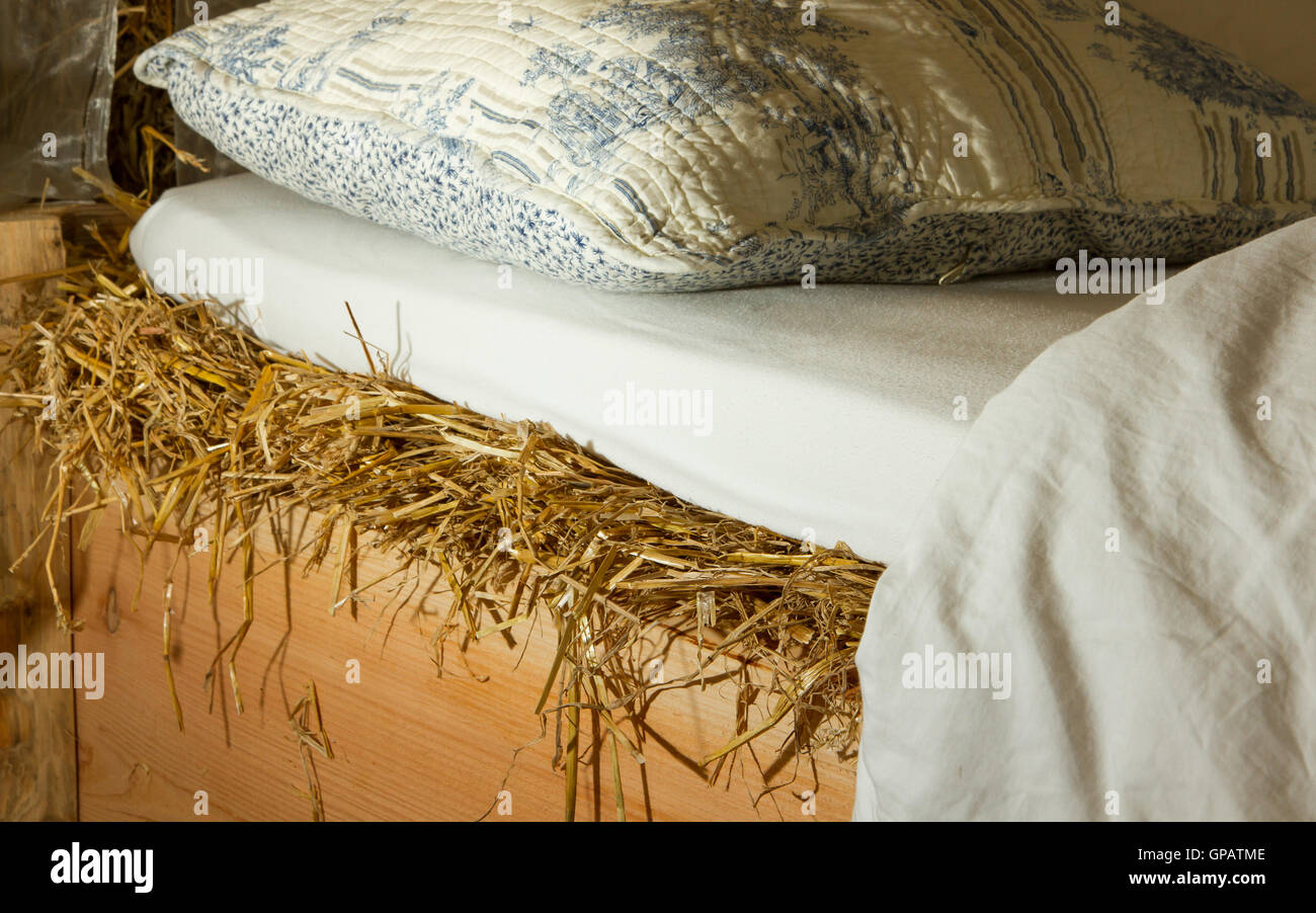 Bed on top of a haystac Stock Photo - Alamy