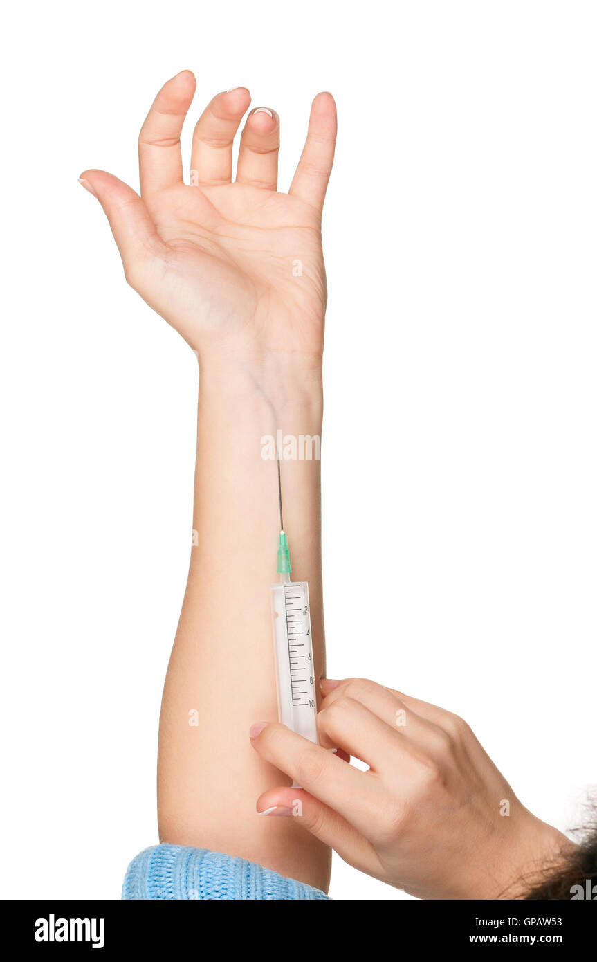 Hand with syringe Stock Photo - Alamy