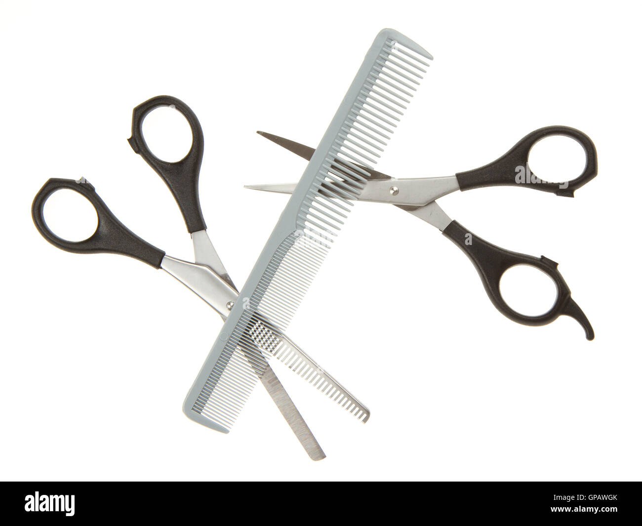 Barber cutting hair scissors comb Cut Out Stock Images & Pictures - Alamy