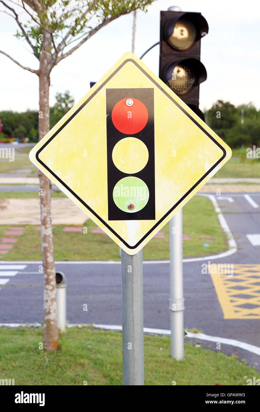 A road sign warning of a traffic light ahead Stock Photo - Alamy