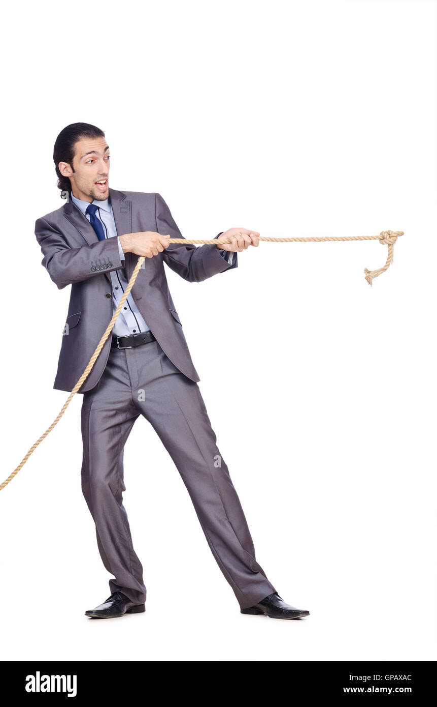 Businessman pulling rope on white Stock Photo - Alamy
