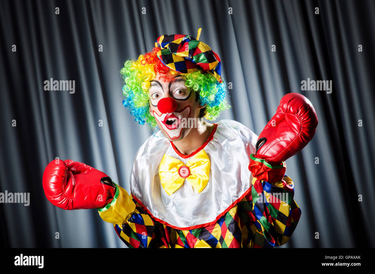 Funny clown in the studio shooting Stock Photo - Alamy