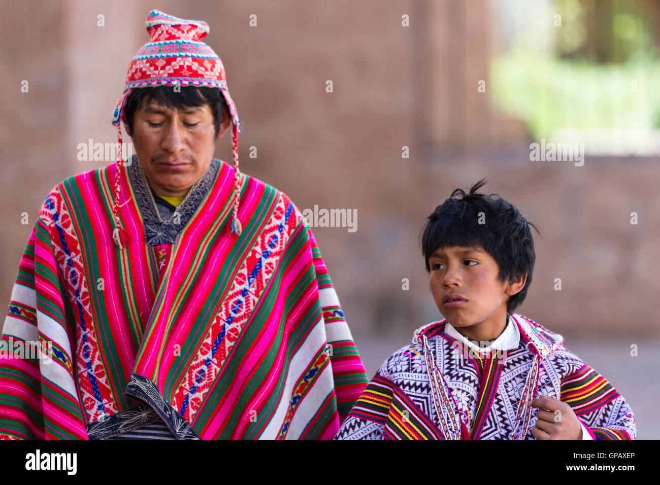Pisac, Peru - May 15: Quechua Man walking with his son dressed in ...