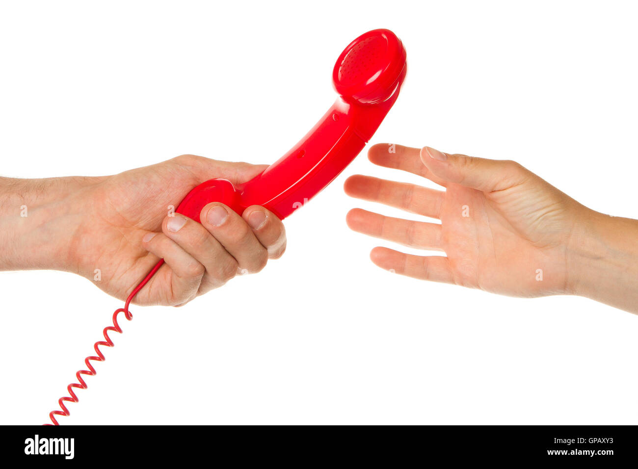 Man giving red telephone to woman Stock Photo - Alamy