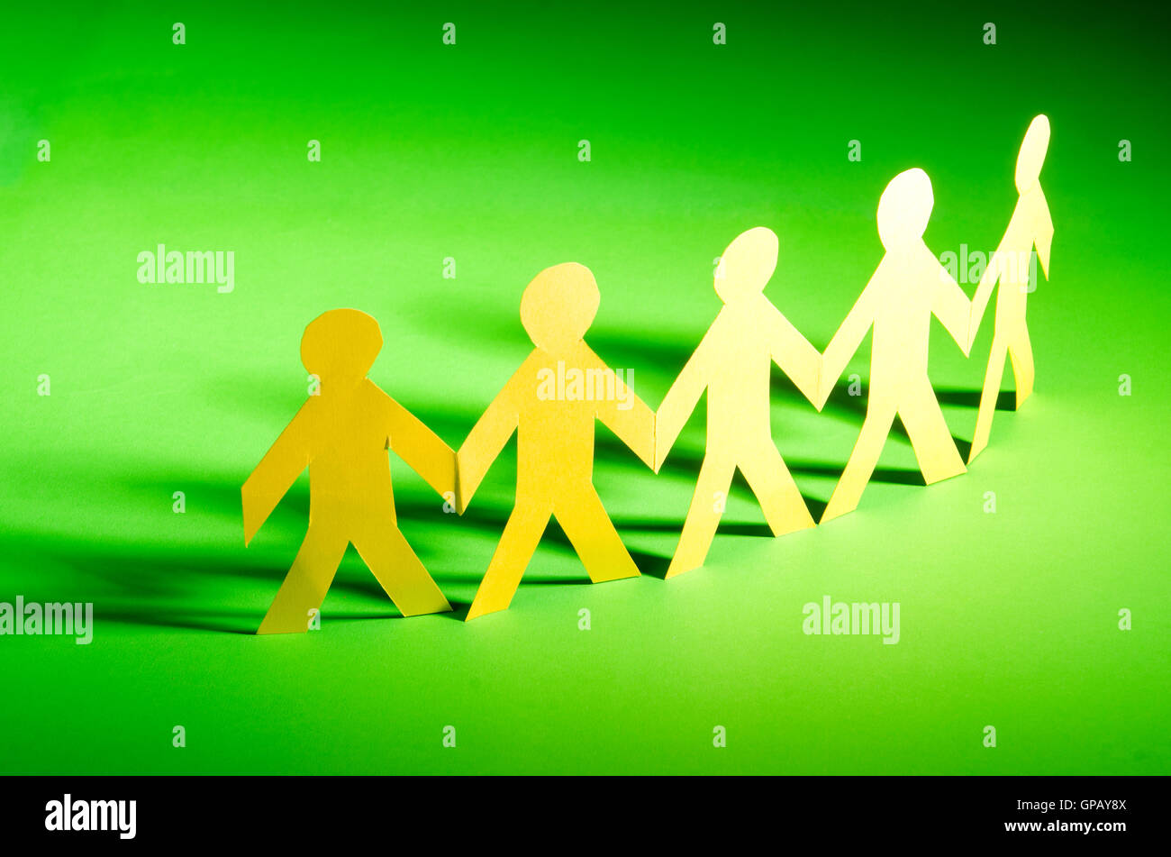 Paper people in teamworking concept Stock Photo - Alamy