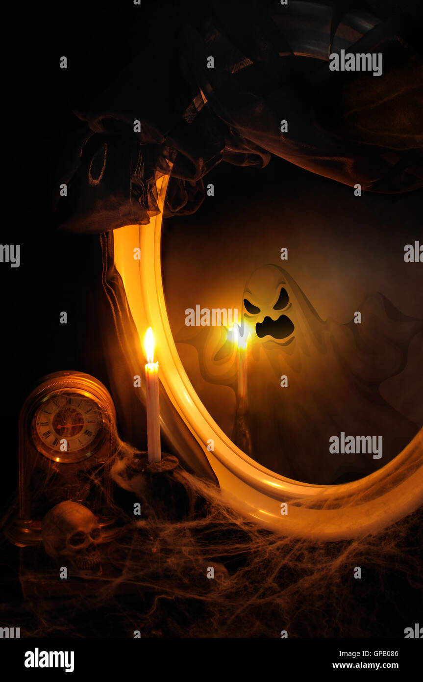Ghost reflection in the mirror on the table with a candle, clock ...