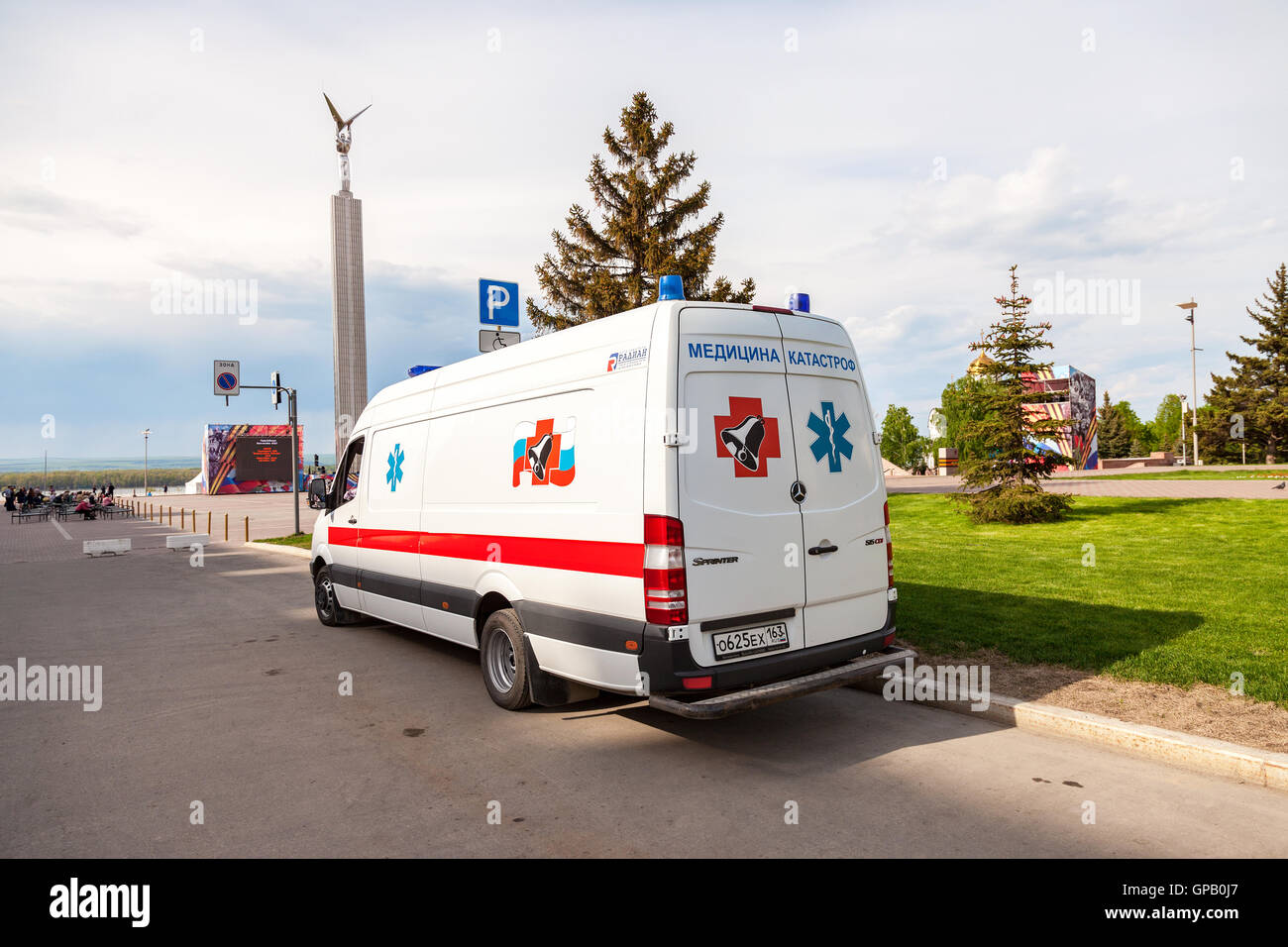Ambulance car parked up in the street. Text in russian: "Emergency ...