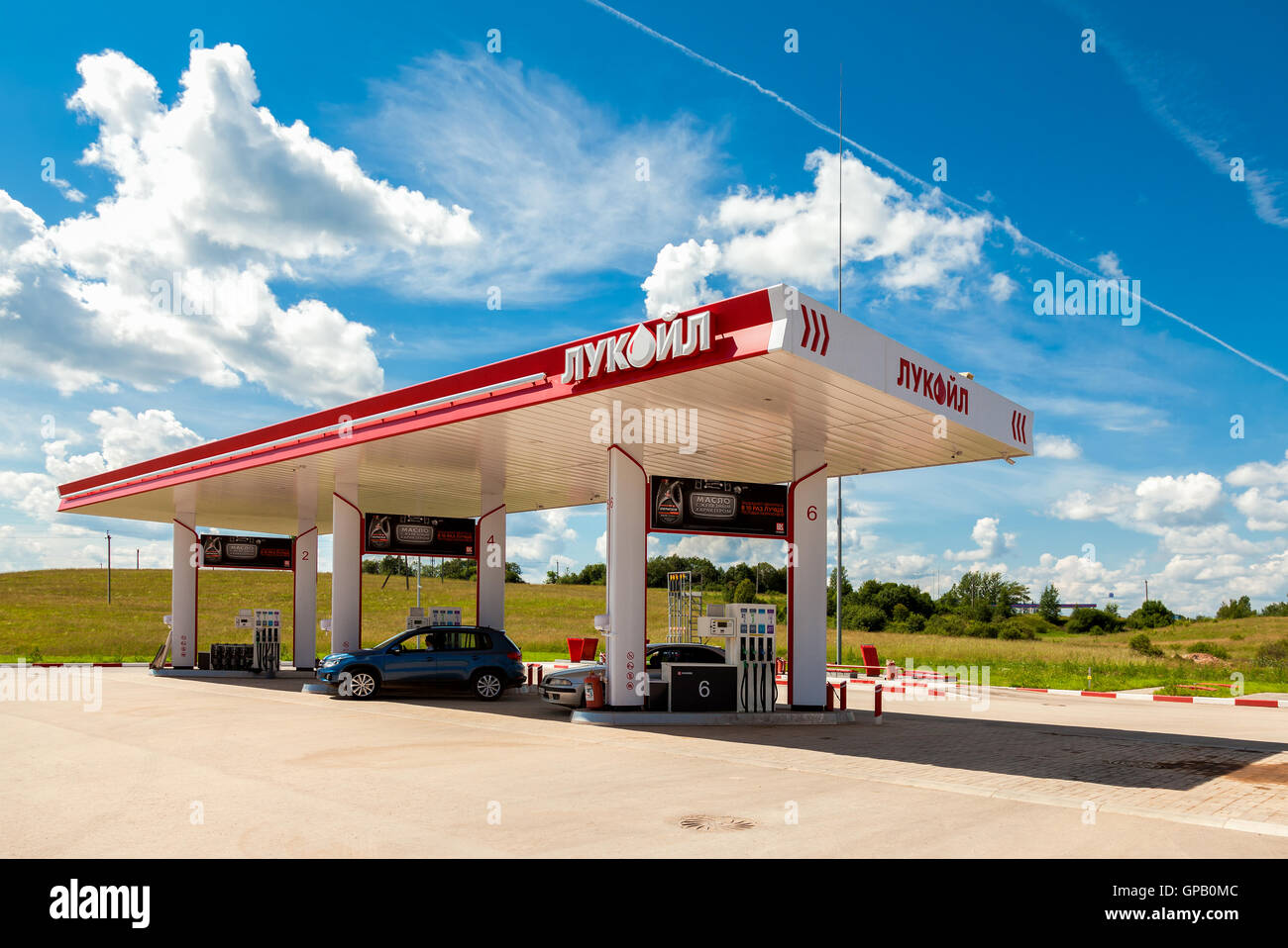 Lukoil gas station with fueling cars Stock Photo - Alamy