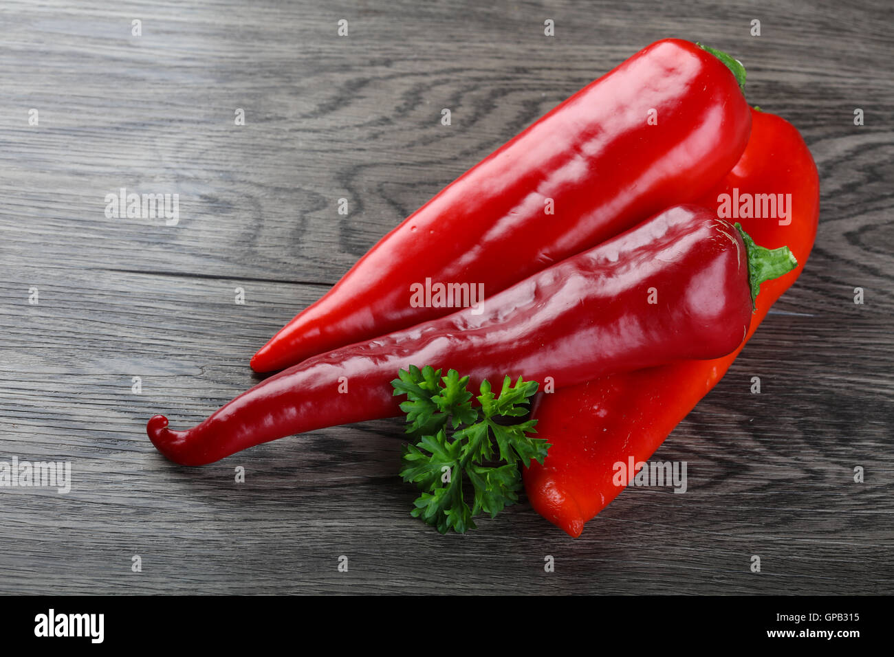 Fresh ripe Ramiro pepper on wood background Stock Photo - Alamy