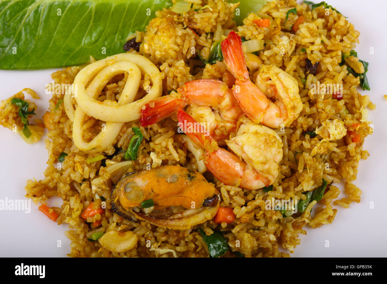 Fried rice with seafood - shrimp, mussel, squid Stock Photo - Alamy