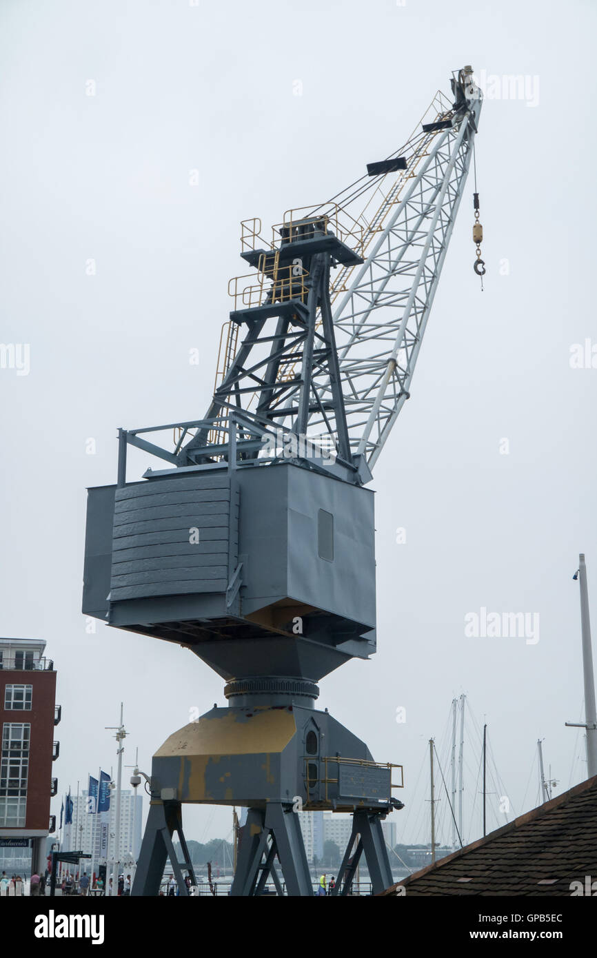 A large dock crane used for loading goods on and off ships in dock ...
